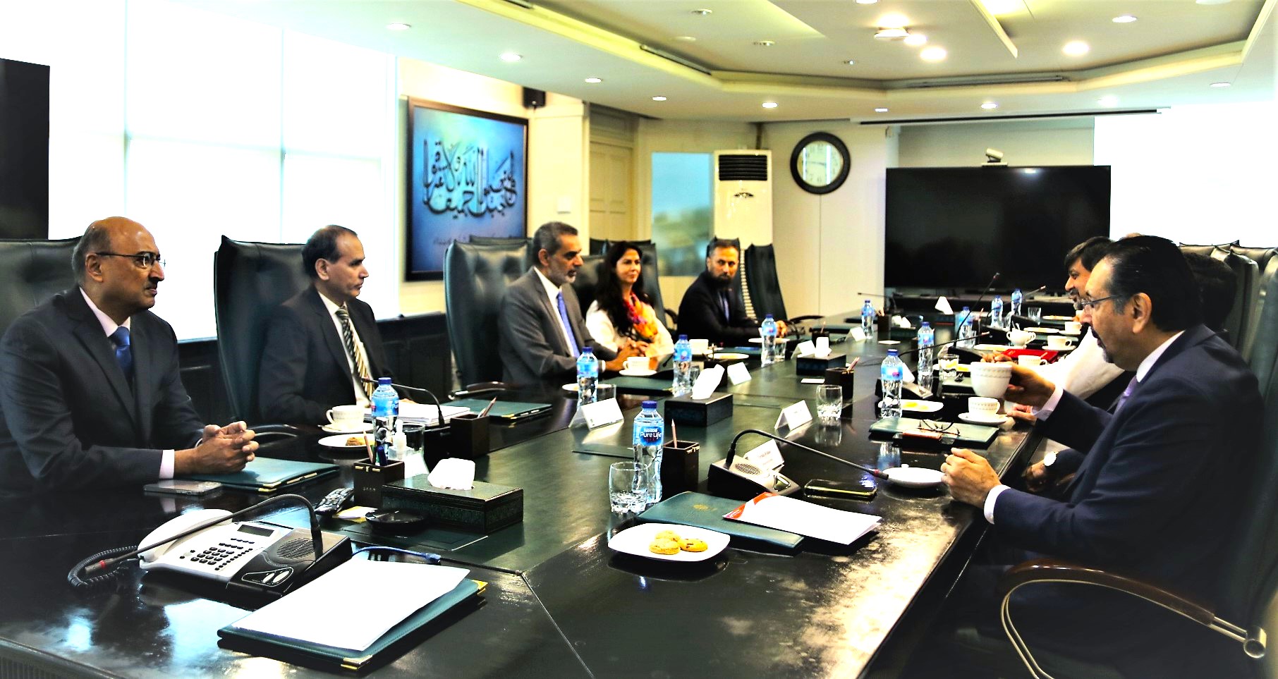 SECP Chairman Akif Saeed unveiled a commemorative postage stamp to mark ...